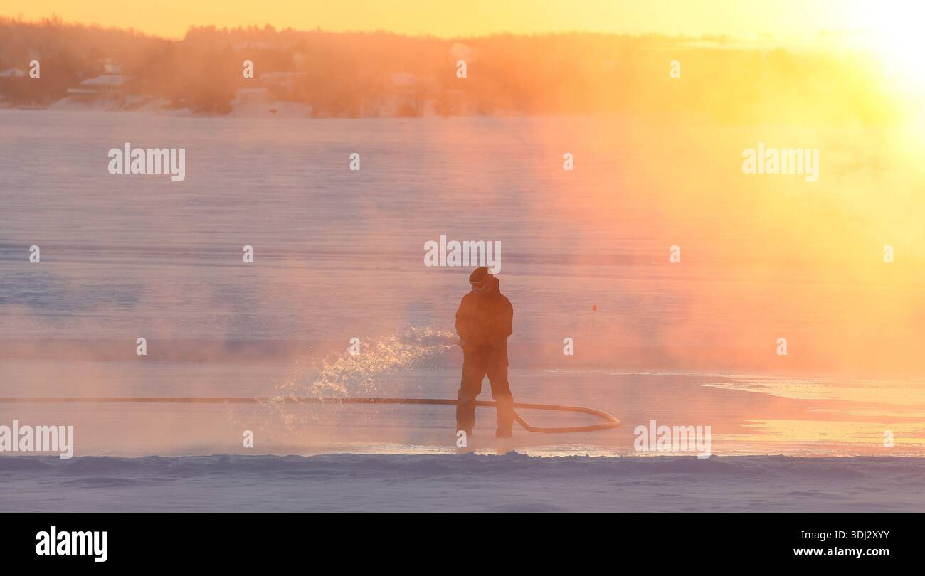 A worker floods the ice on the Ramsey Lake Skating Path in Sudbury, Ont ...