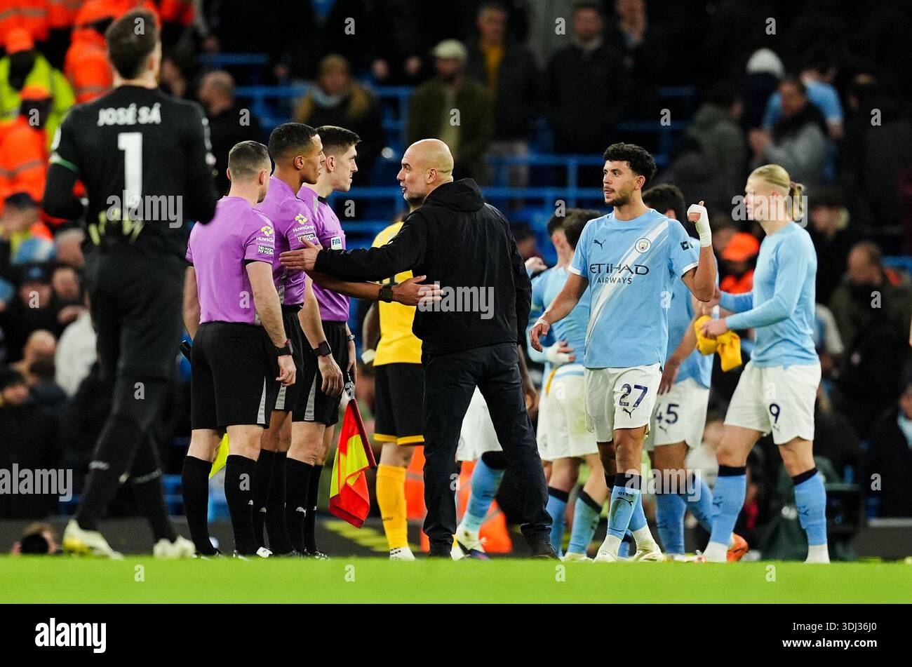 Manchester City manager Pep Guardiola with referee Farai Hallam ...