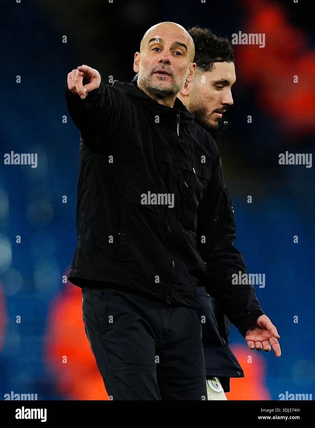 Manchester City manager Pep Guardiola and Rayan Cherki following the ...