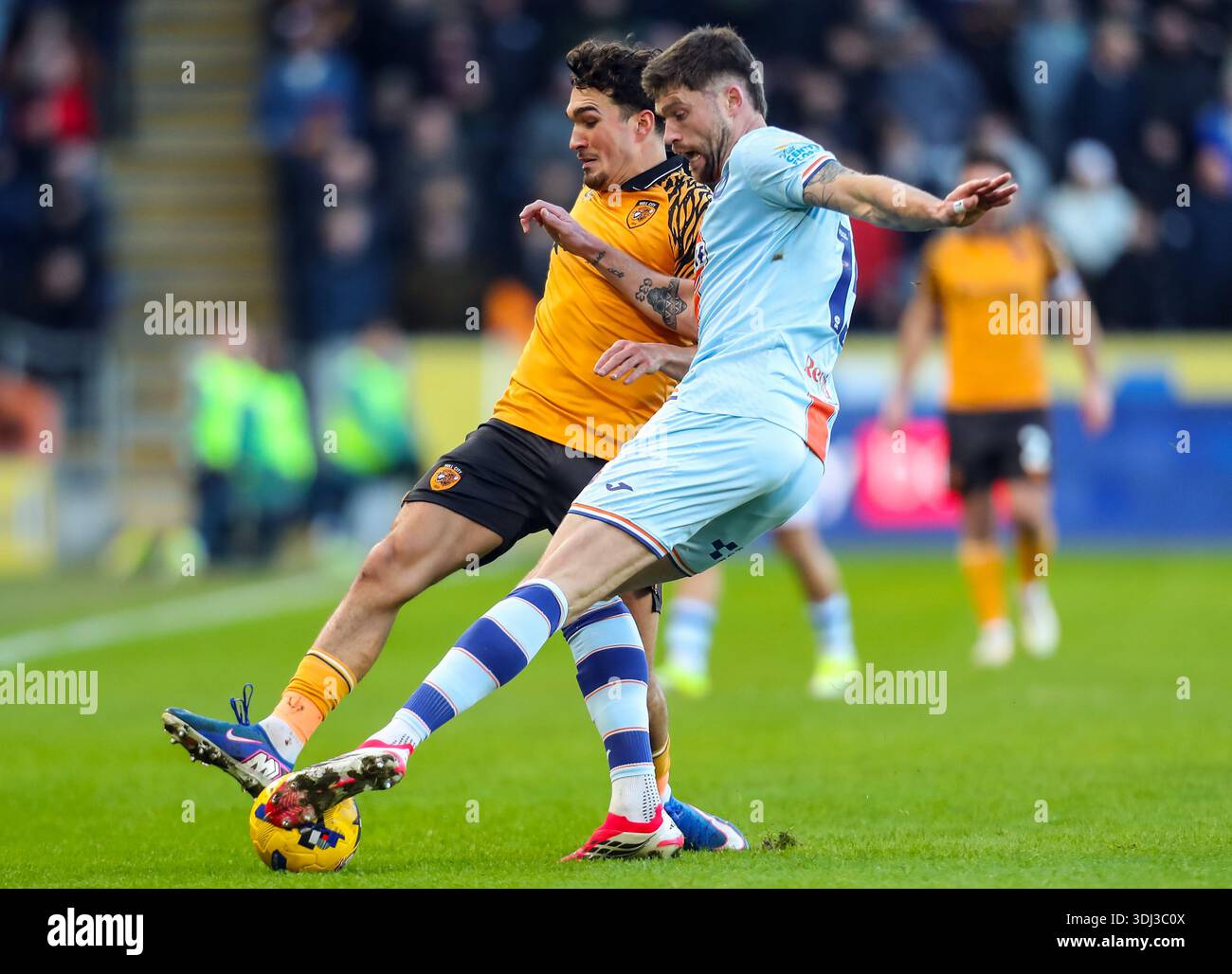Hull City's Kyle Joseph battles for the ball with Swansea City's ...
