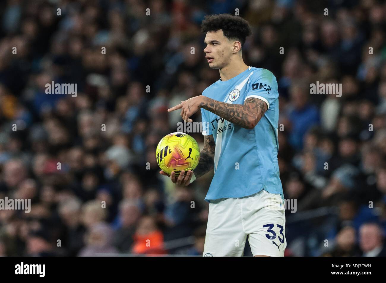 Nico O'Reilly of Manchester City prepares to take a throw-in during the ...