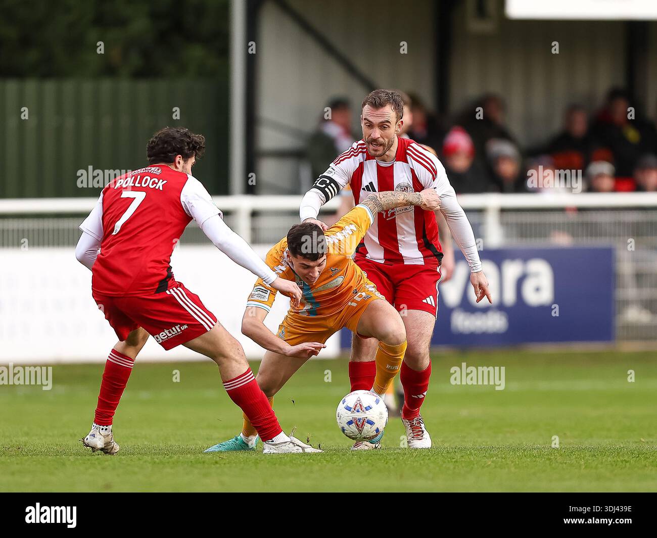 BRACKLEY, ENGLAND - JANUARY 24: Shane Byrne of Brackley Town tackles ...