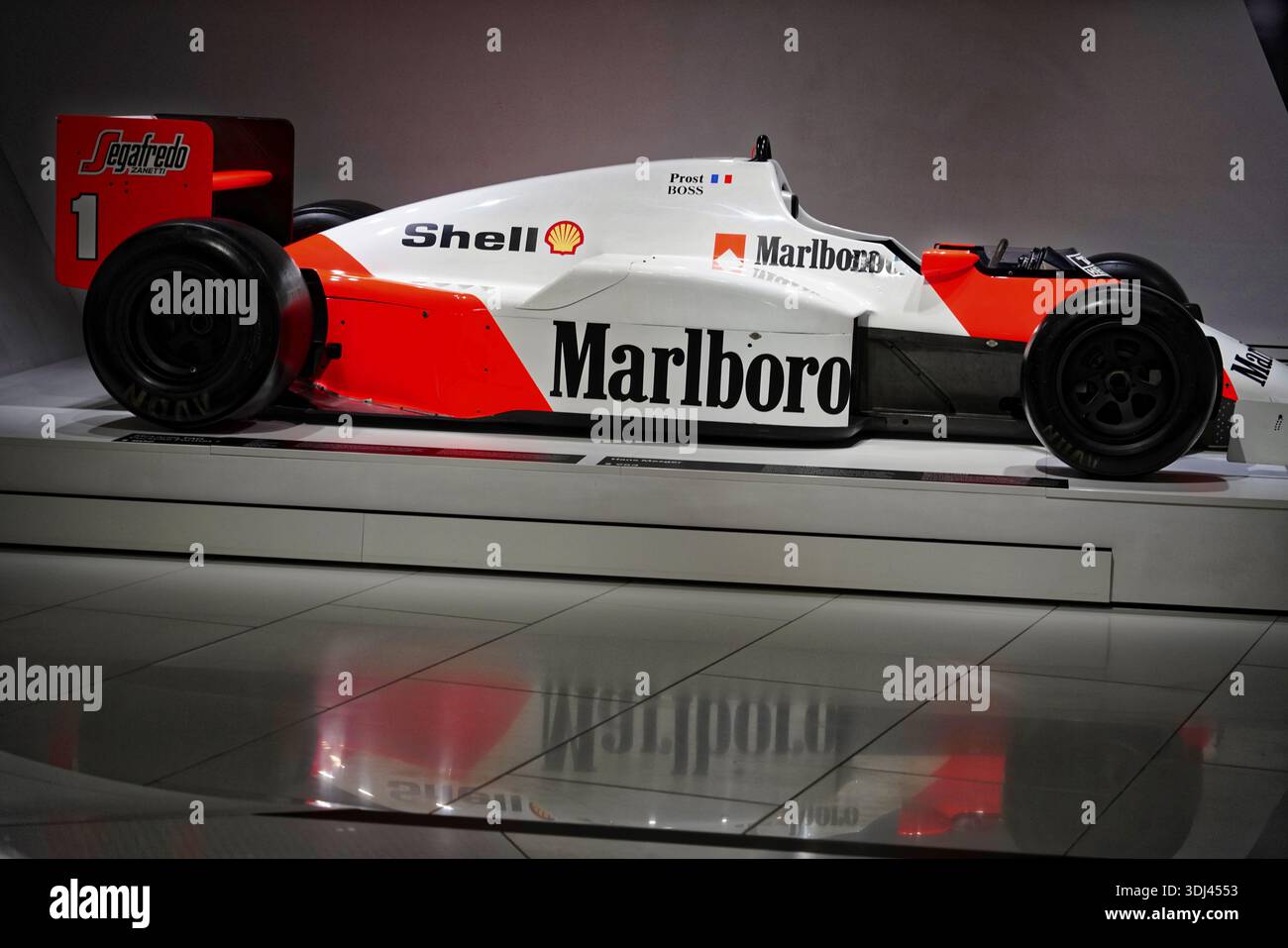 White-red Formula One racing car with prominent sponsor logos on ...