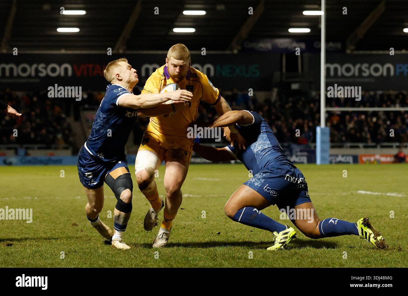 Northampton Saints' Craig Wright (centre) is tackled during the ...