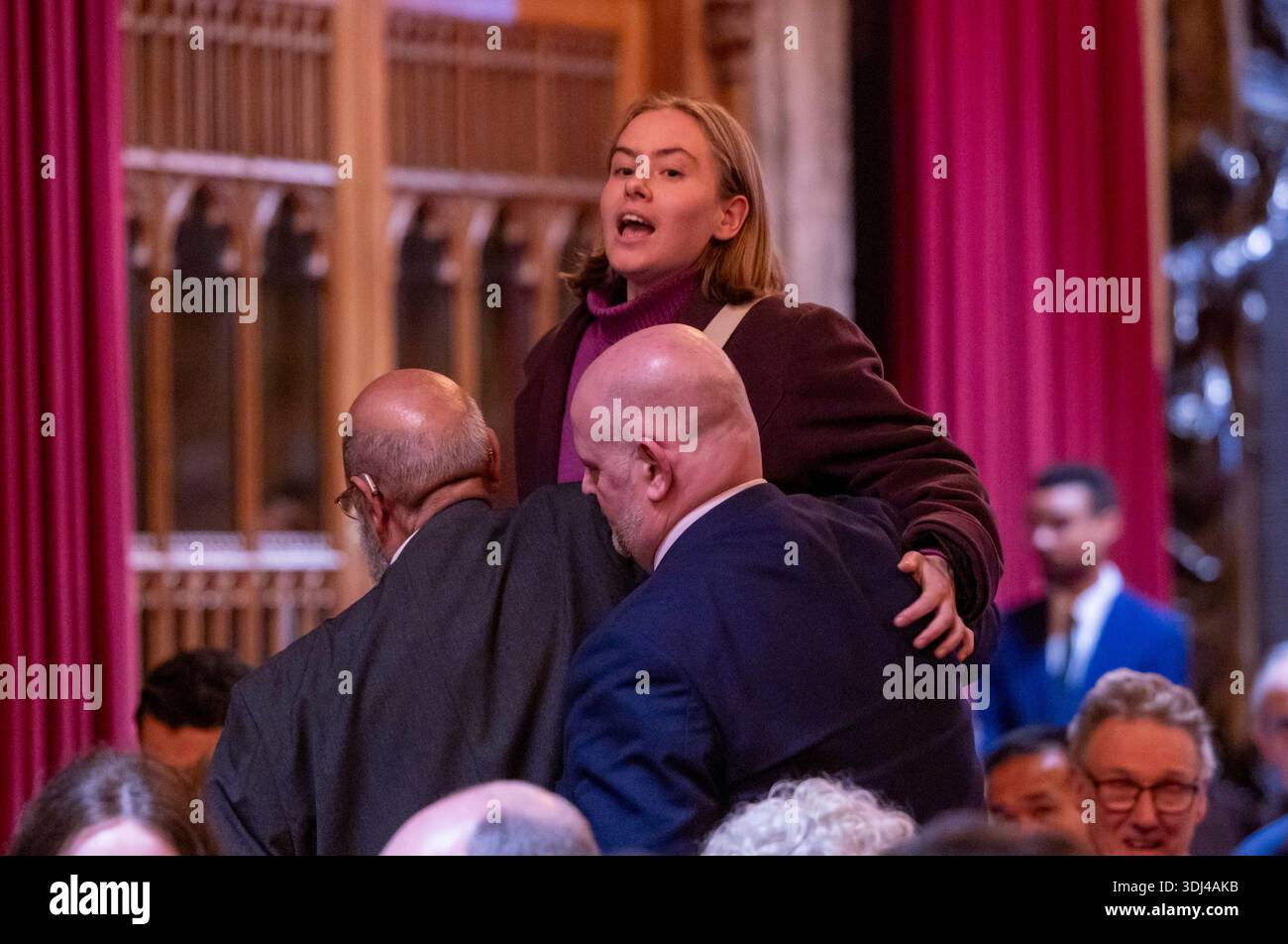 London, UK. 24th Jan 2026 A protestor is ejected after shouting during ...