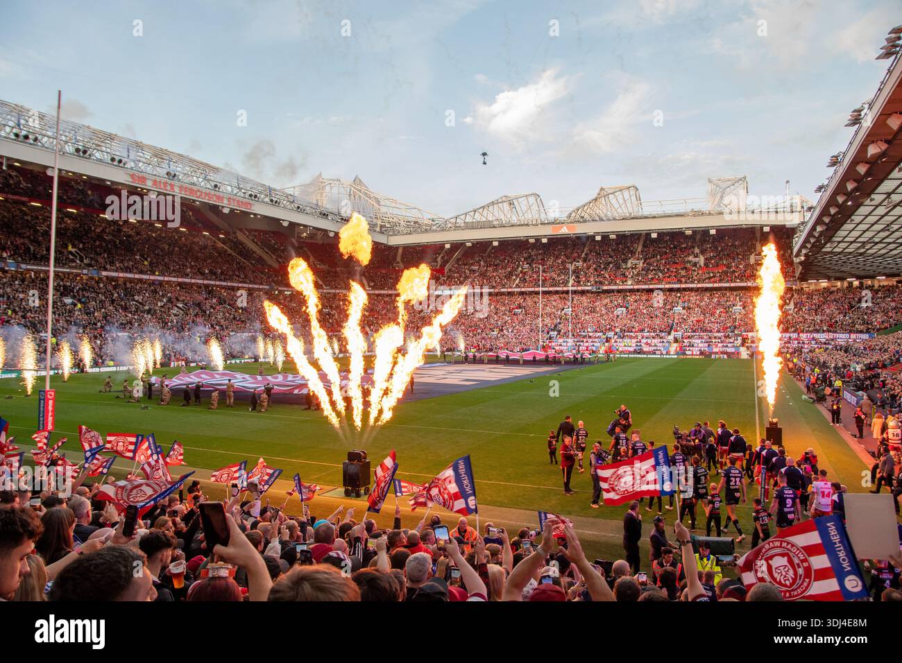 The teams walk out at the start of the match hi-res stock photography ...