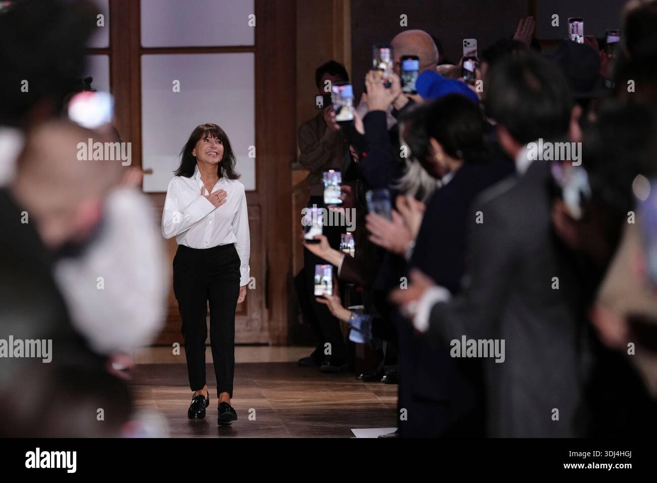 Designer Veronique Nichanian accepts applause after the Hermes Fall ...