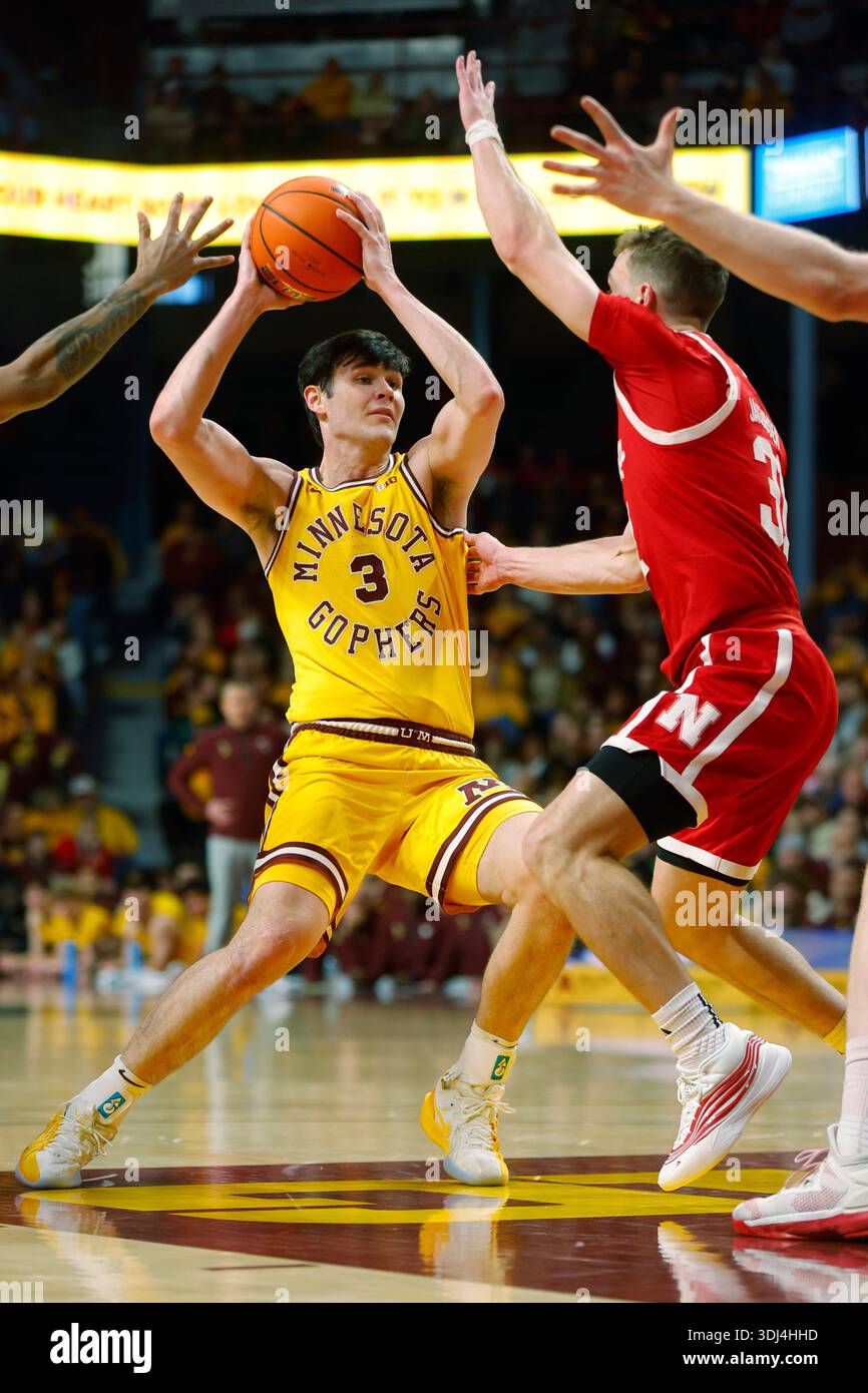 Minnesota forward Bobby Durkin (3) works around Nebraska guard Cale ...