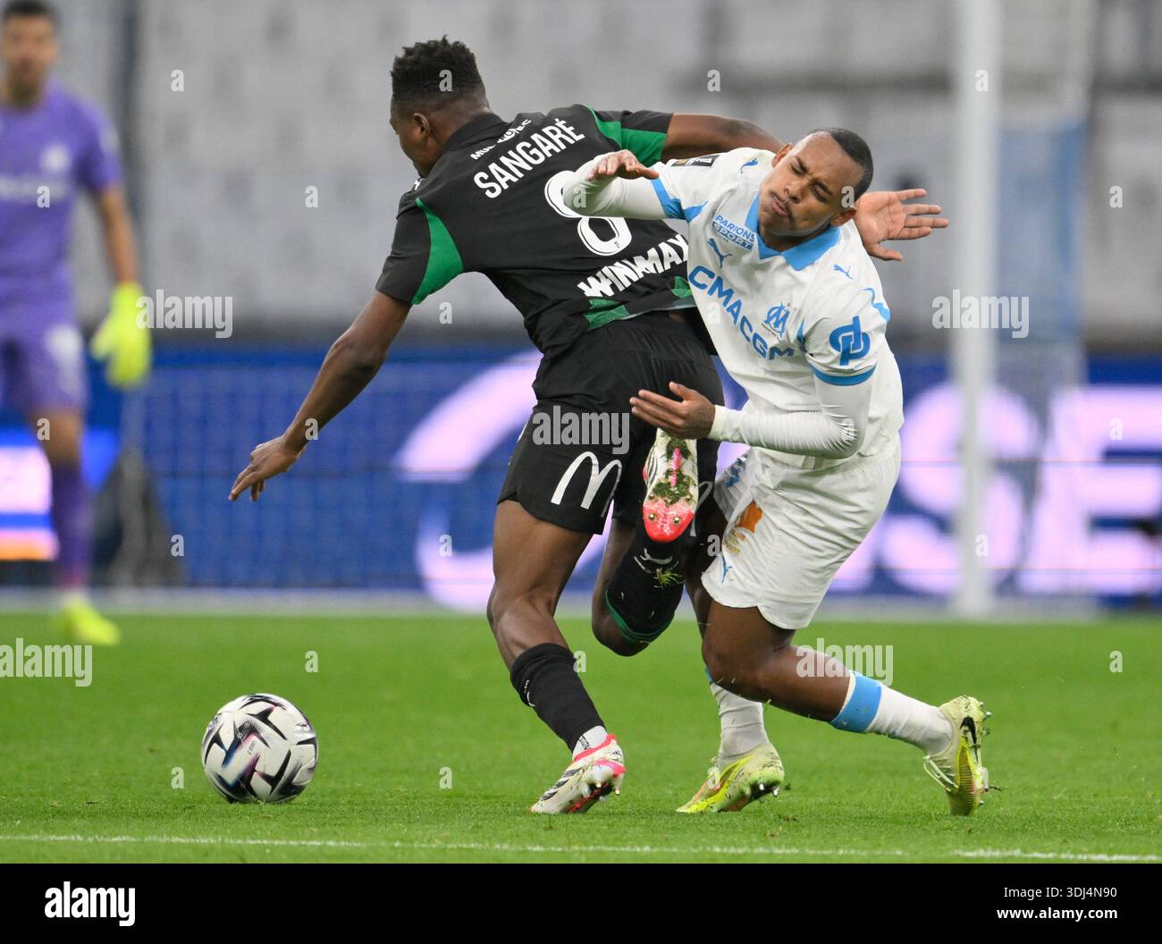 Lens' Mamadou Sangare, left, vies for the ball against Marseille's Igor ...
