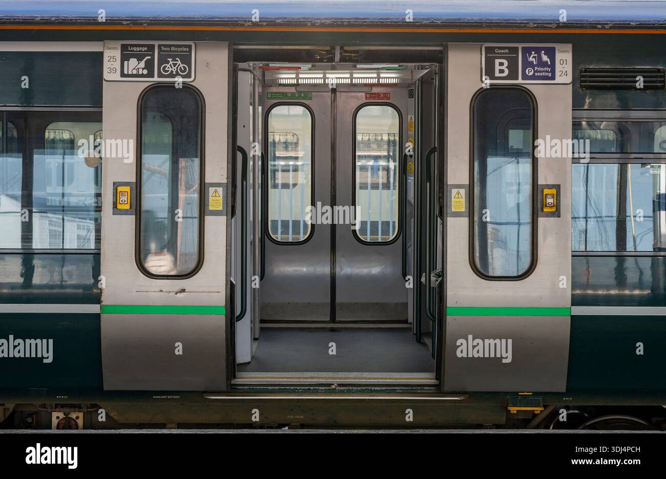 Close-up of sliding carriage doors on a modern multiple unit train in a ...