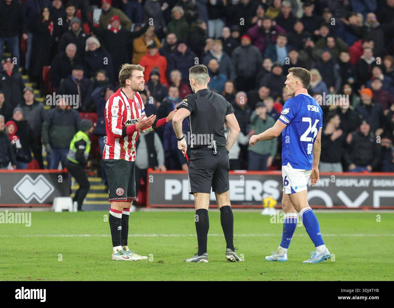 referee Tom Nield gives a red card to Patrick Bamford of Sheffield ...