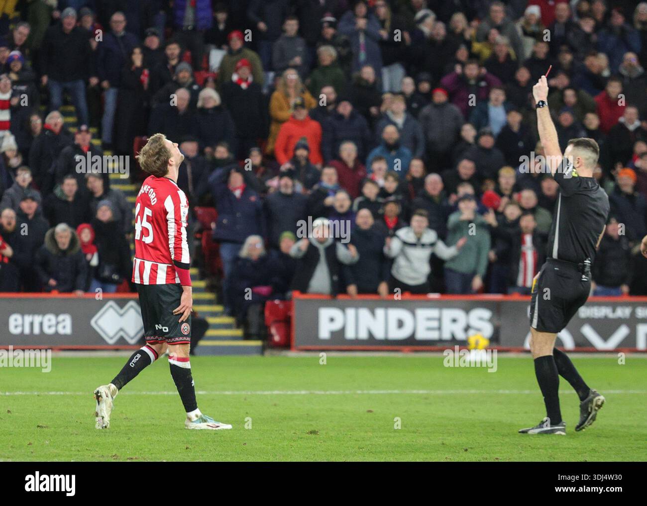referee Tom Nield gives a red card to Patrick Bamford of Sheffield ...