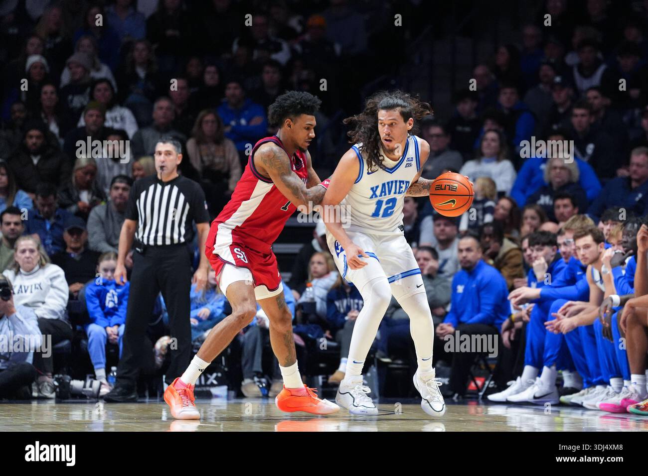Xavier's Tre Carroll posts up St. John's Dillon Mitchell during the ...