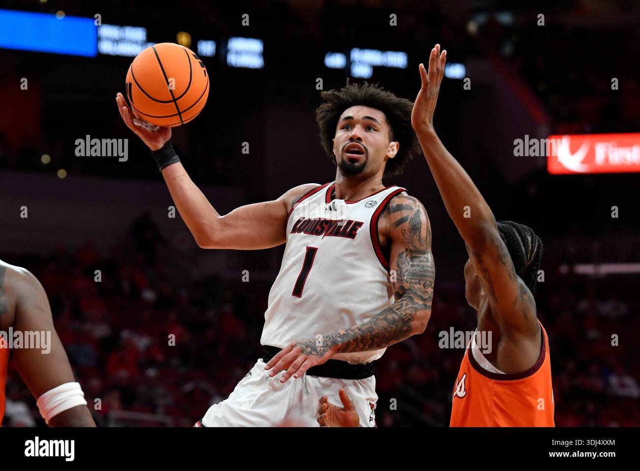 Louisville guard J'vonne Hadley (1) attempts a pass over Virginia Tech ...