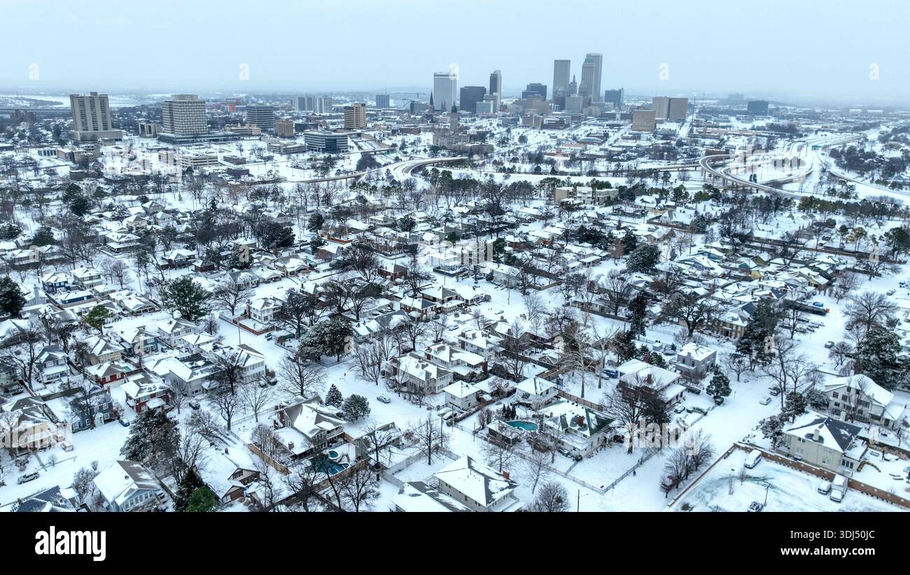 Snow blankets the city in an aerial view from 17th Pl. and Peoria Ave ...