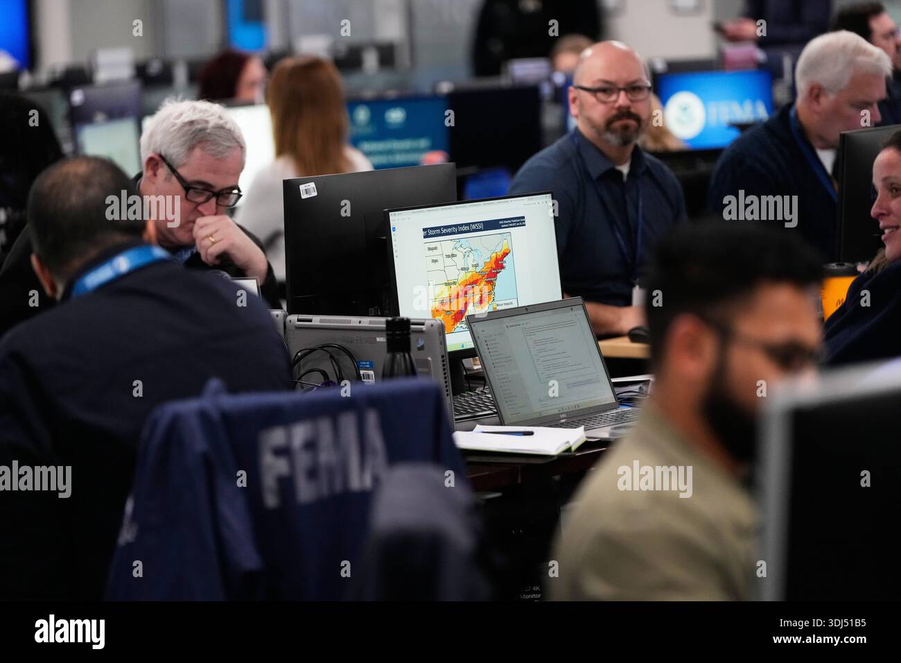 People work at FEMA Headquarters, Saturday, Jan. 24, 2026, in ...