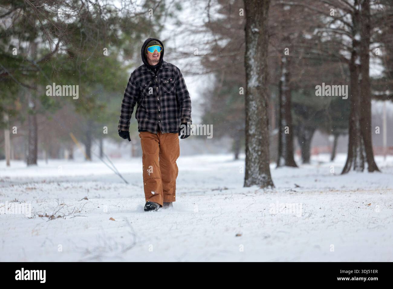 Bryce Taylor takes a walk in the snow Saturday, Jan. 24, 2026 in Tulsa ...