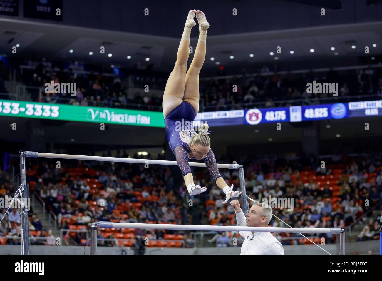 Auburn's Marissa Neal competes on the uneven bars during an NCAA ...