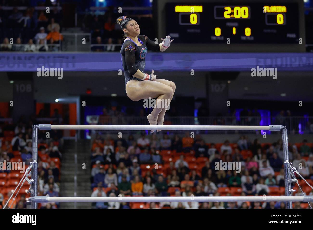 Florida's Kayla DiCello competes on the uneven bars during an NCAA ...
