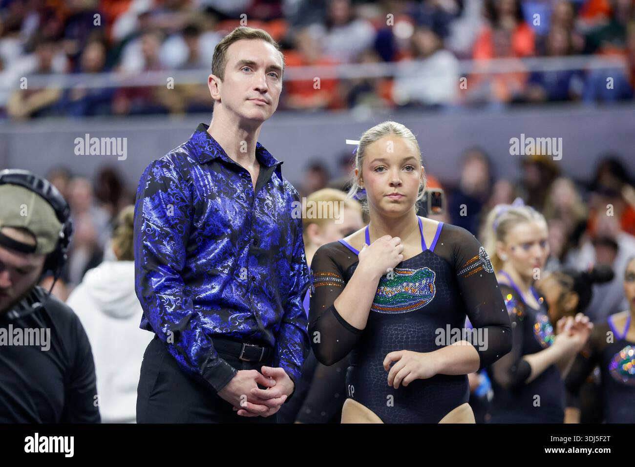 Florida assistant coach Jeremy Miranda, left, and Lily Bruce watch a ...