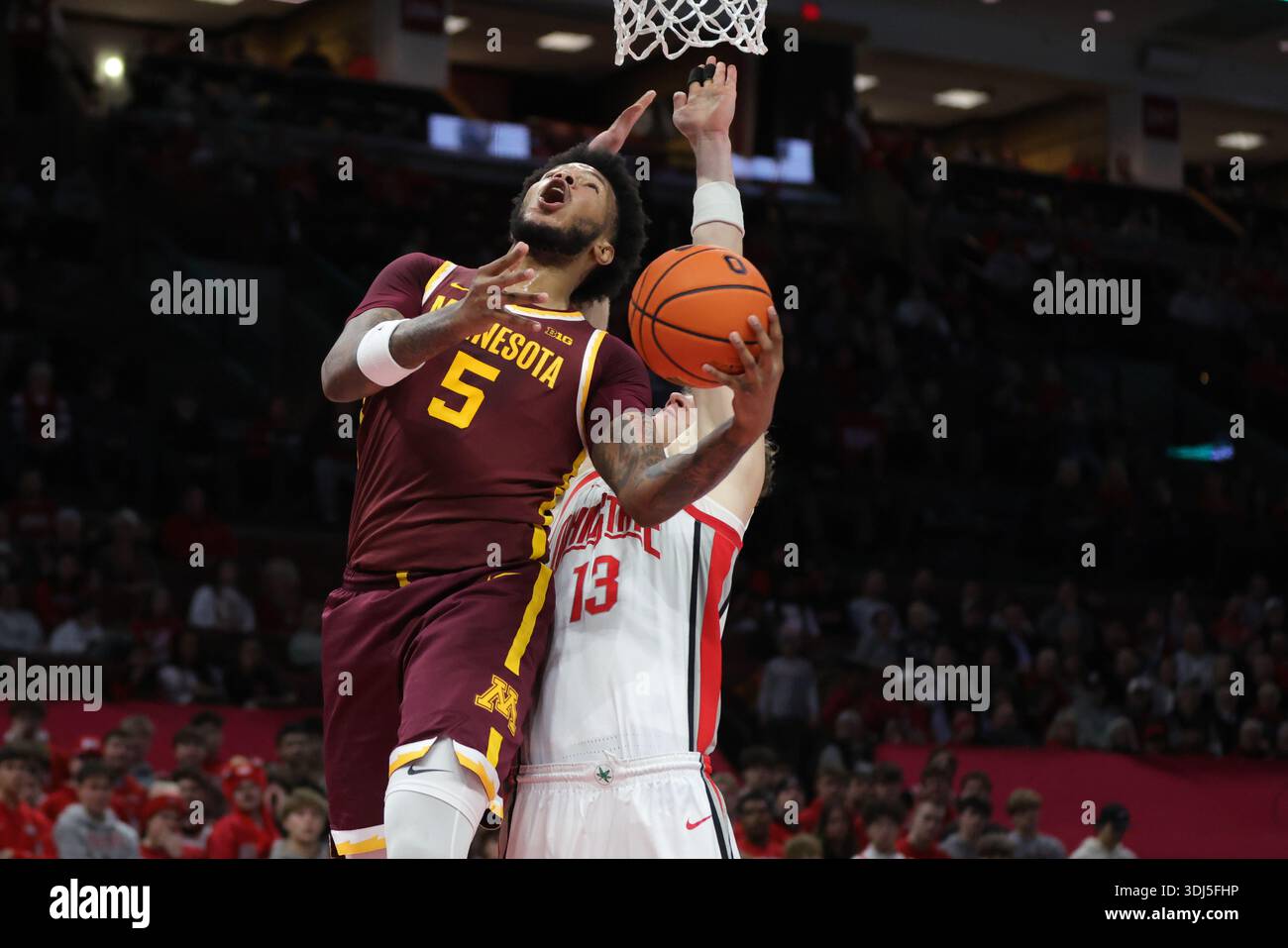 Minnesota forward Jaylen Crocker-Johnson, left, shoots in front of Ohio ...