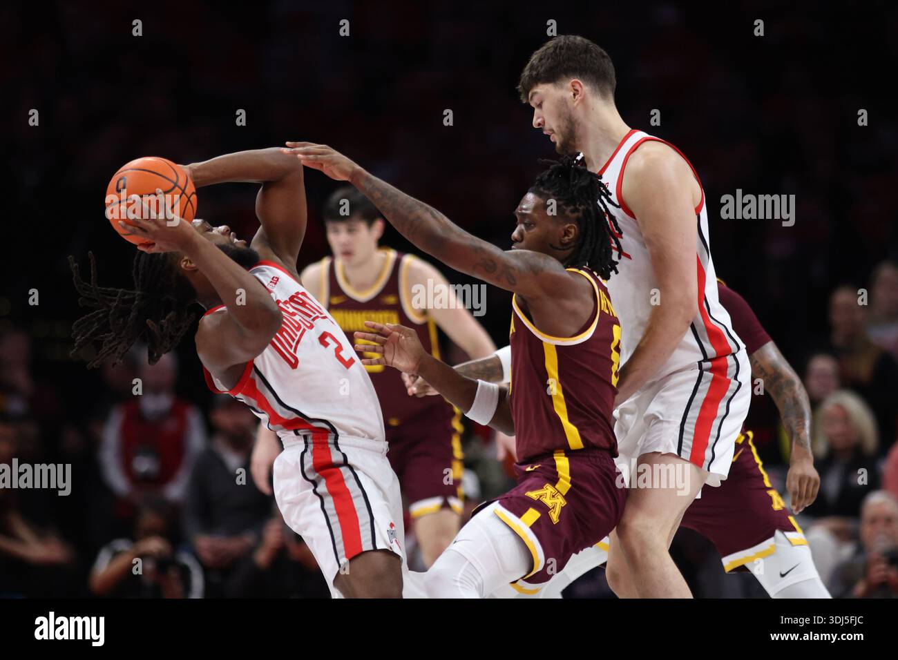 Ohio State guard Bruce Thornton, left, works in front of Minnesota ...