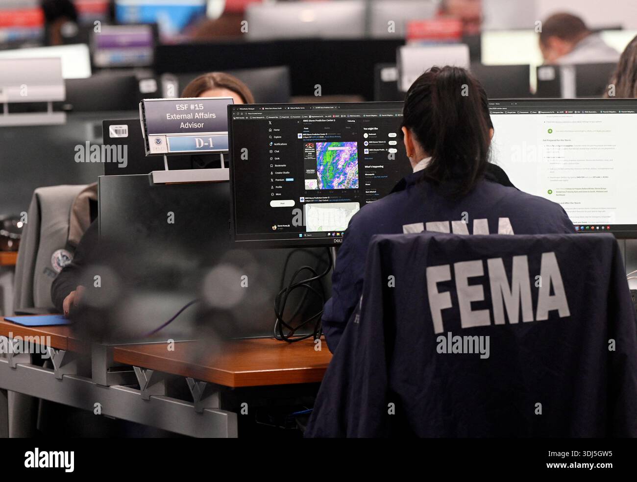 Employees work at the National Response Coordination Centerat at the ...