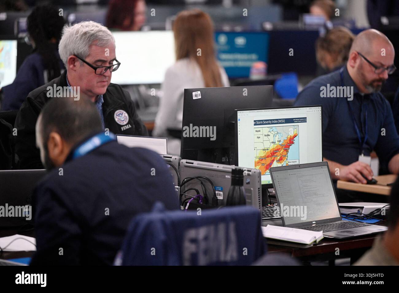 Employees work at the National Response Coordination Centerat at the ...
