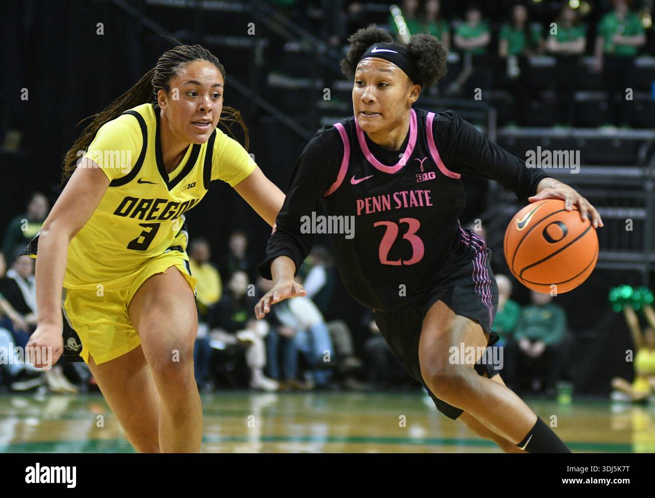 Penn State guard Kiyomi McMiller (23) dribbles in front of Oregon guard ...