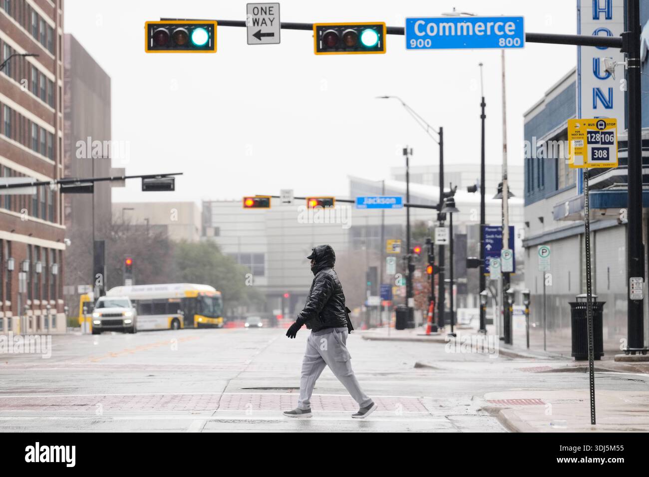 A person walks along Commerce street in the downtoan area during frigid ...