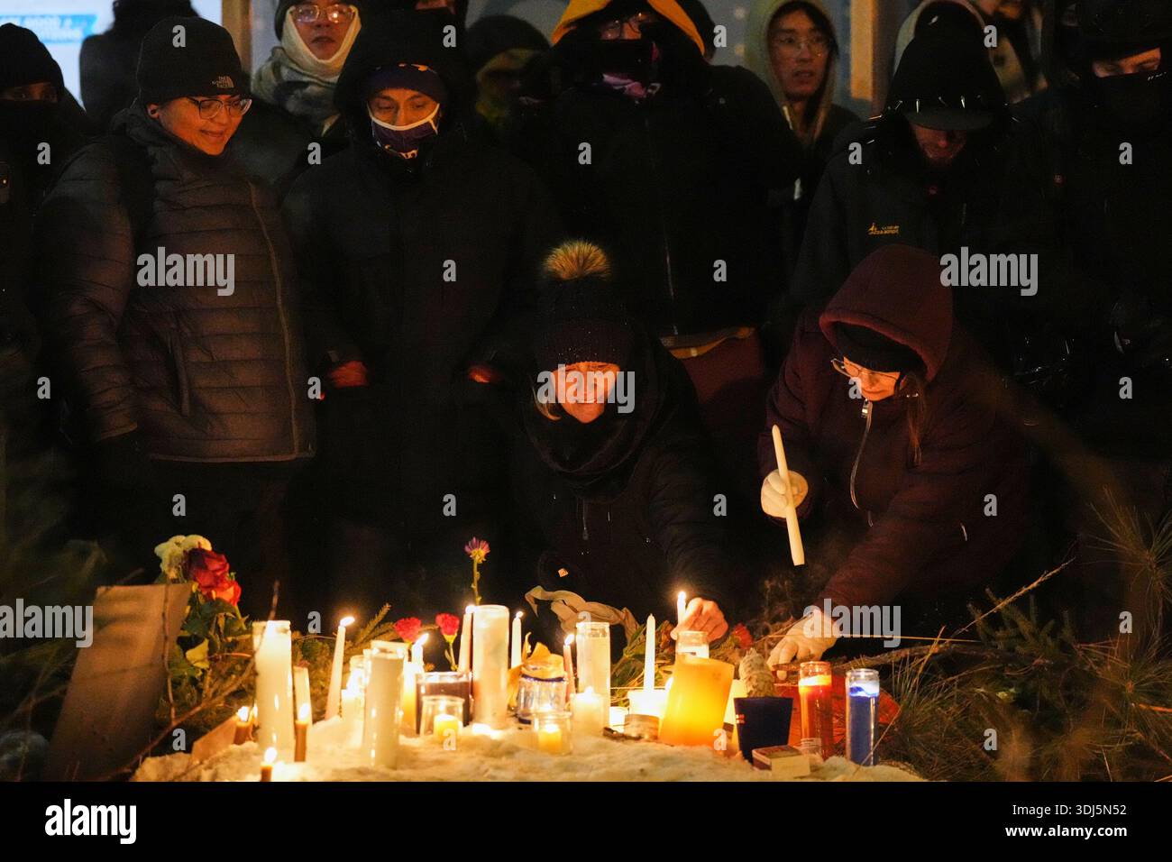 People gather during a vigil for 37-year-old Alex Pretti, who was ...