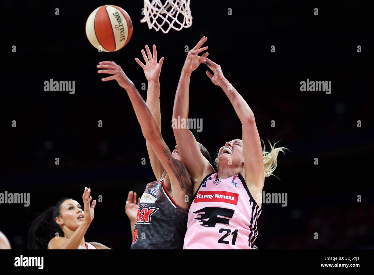 Anneli Maley of the Lynx and Keely Froling of the Flames compete for ...
