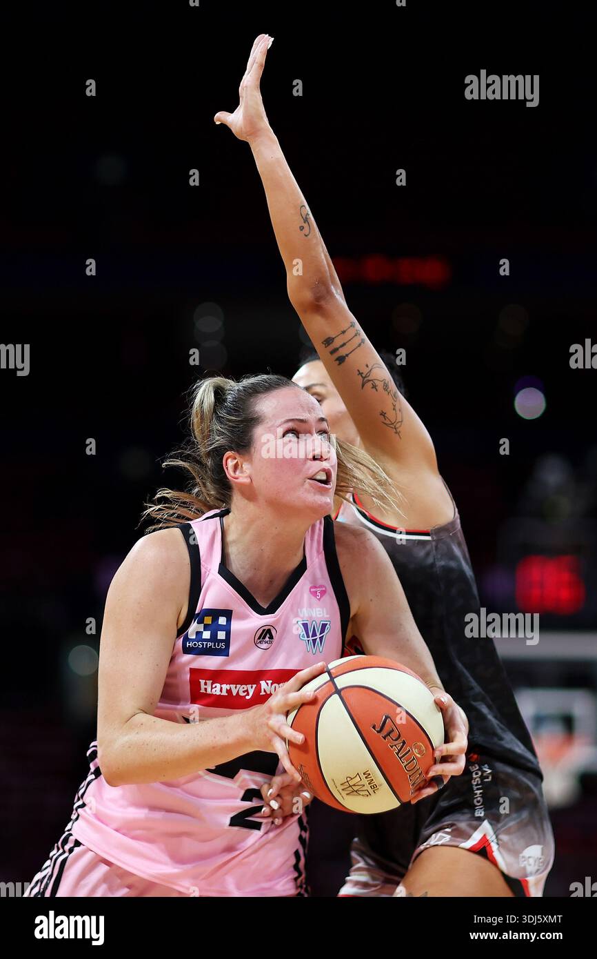 Keely Froling of the Flames drives to the basket during the WNBL Round ...