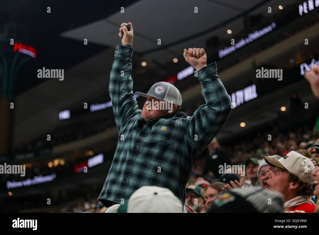 Matt Grindland raises his arms after catching a puck during the first ...