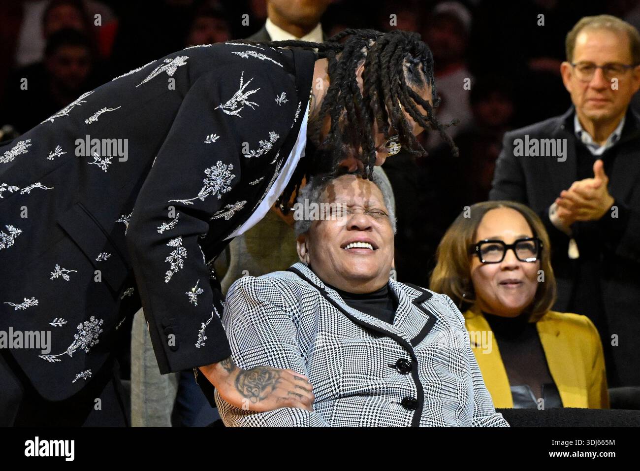 Former Chicago Bulls player Derrick Rose, left, kisses his mom, Brenda ...