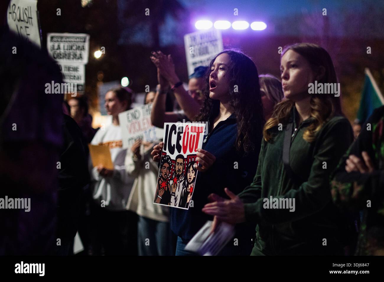 A woman cheers during a protest against federal immigration enforcement ...