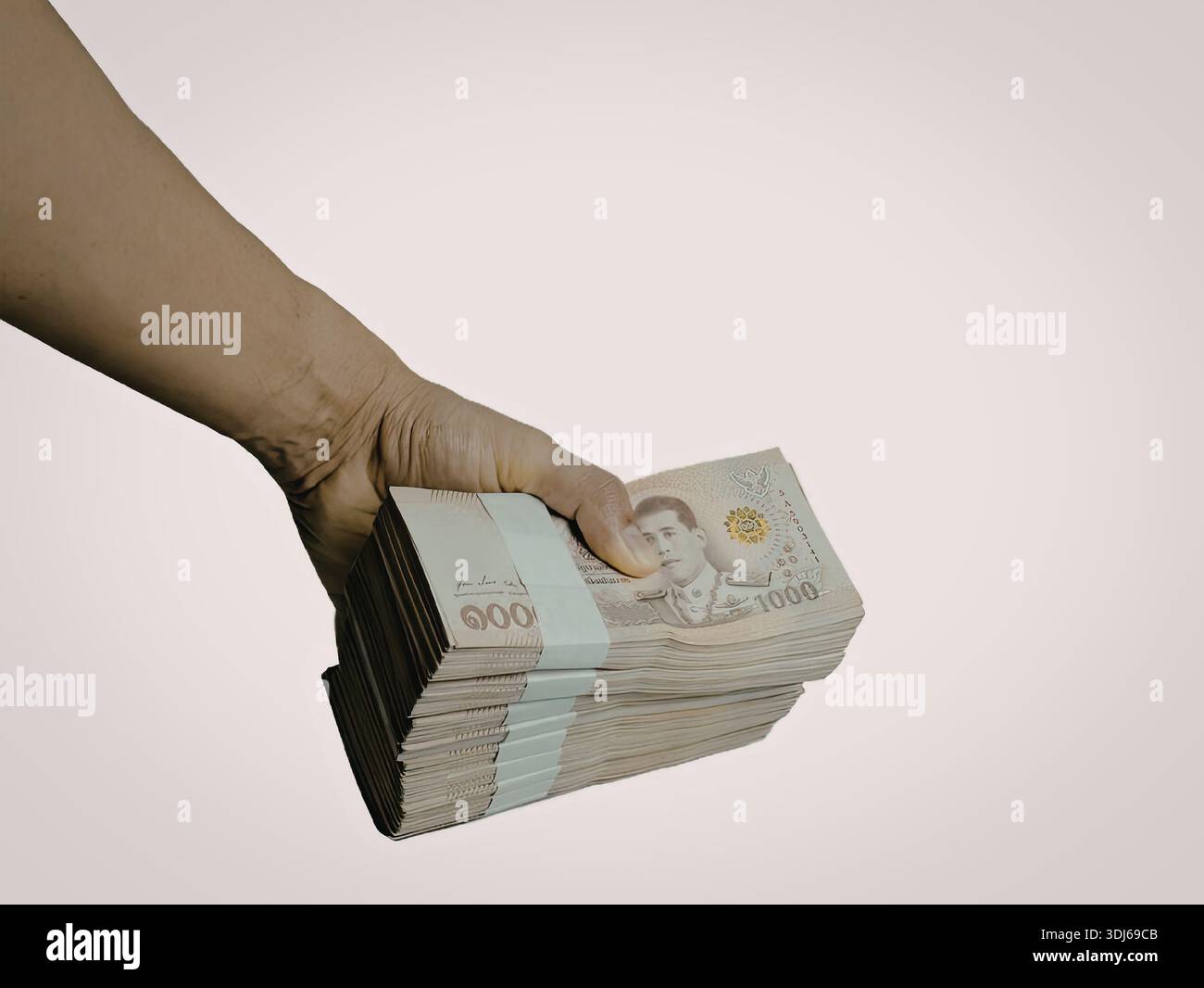 An image showing a hand holding a stack of banknotes, emphasizing the ...