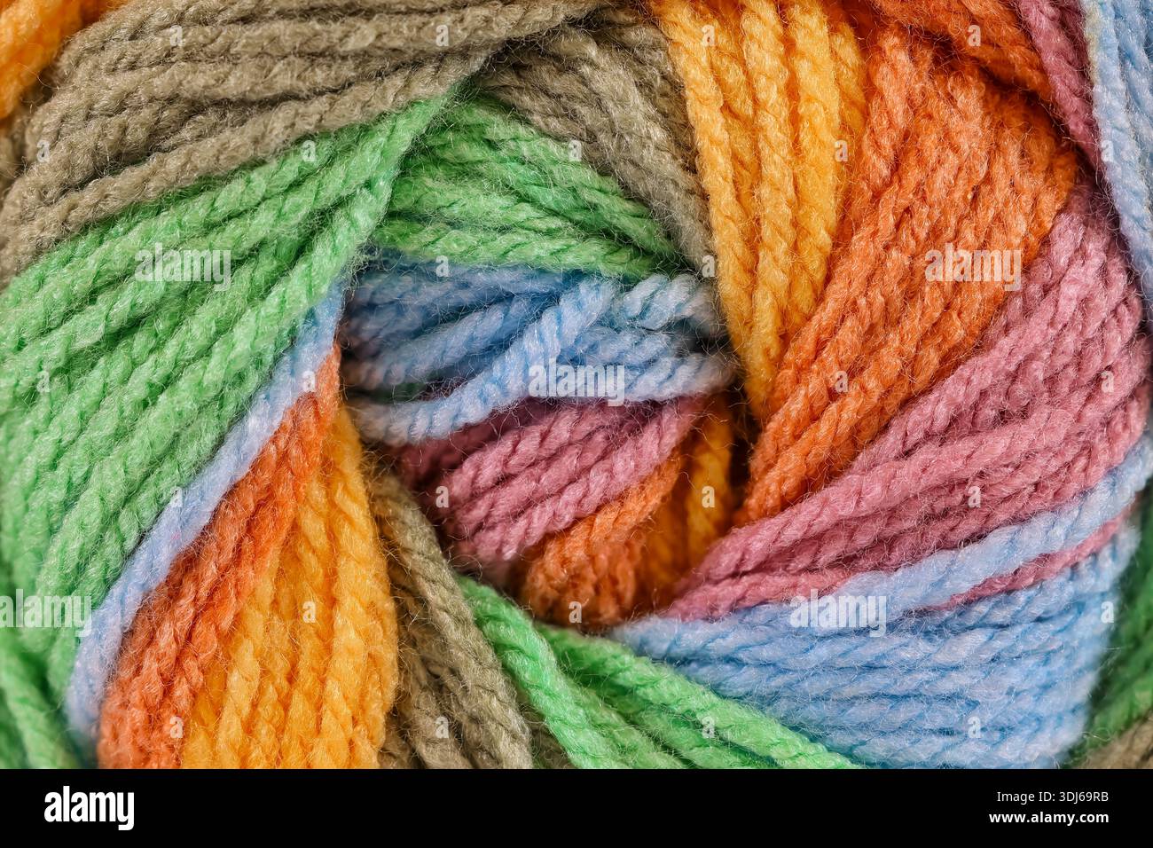 Colorful yarn ball showing vibrant wool threads and soft texture close ...