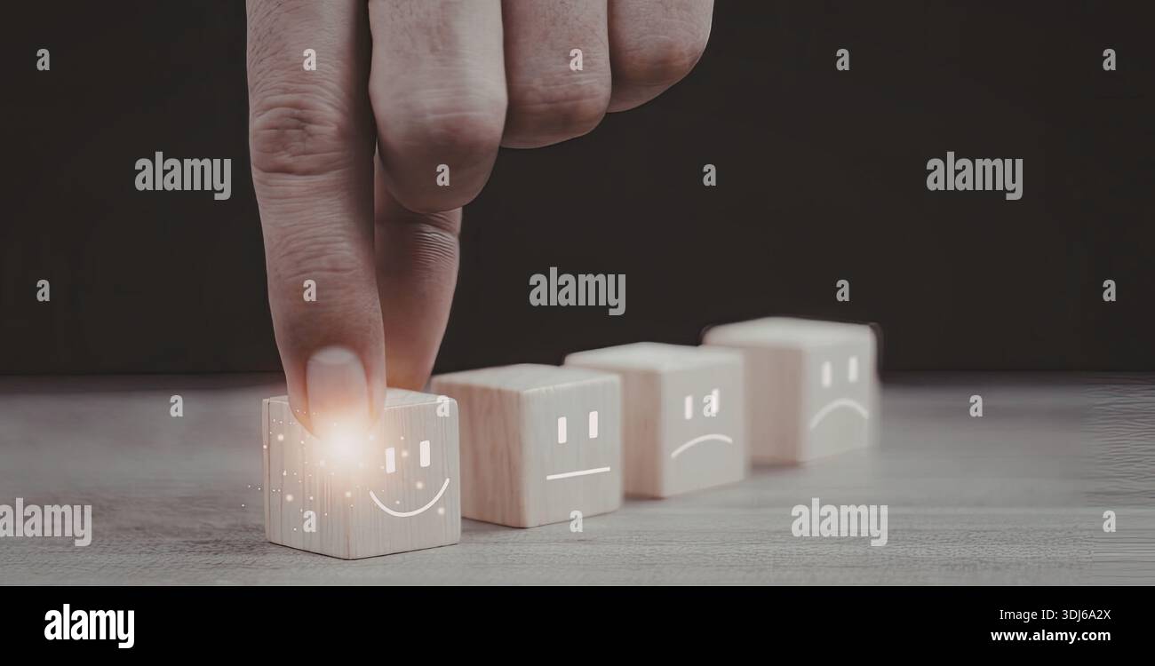 A hand selects a wooden block with a smiley face from a row of blocks ...