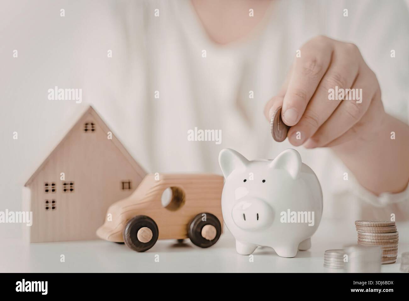 Person depicted saving money hi-res stock photography and images - Alamy