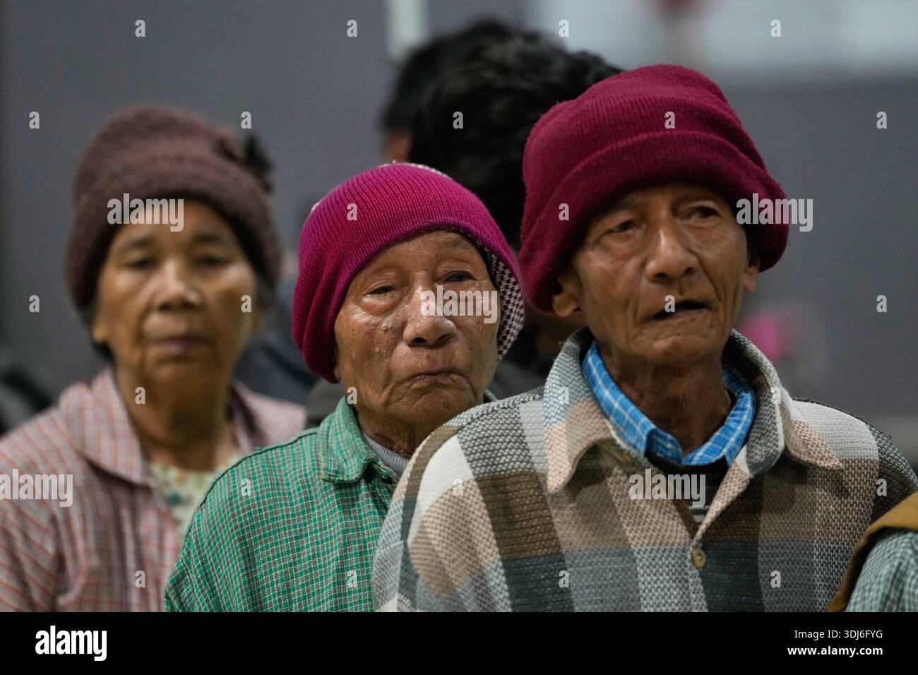 Voters line up to cast ballots at a polling station during the final ...