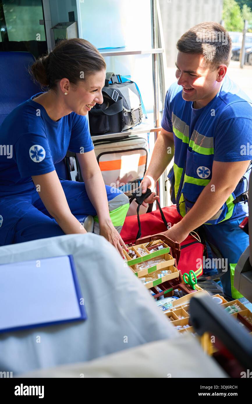 Female medic readying kit for emergency response Stock Photo - Alamy