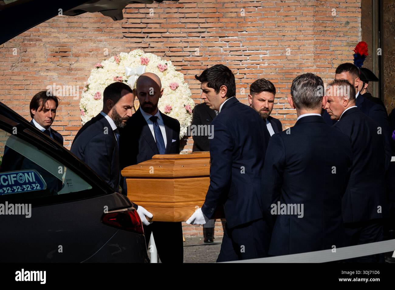 Pallbearers officers carry the coffin of Valentino Garavani during the ...
