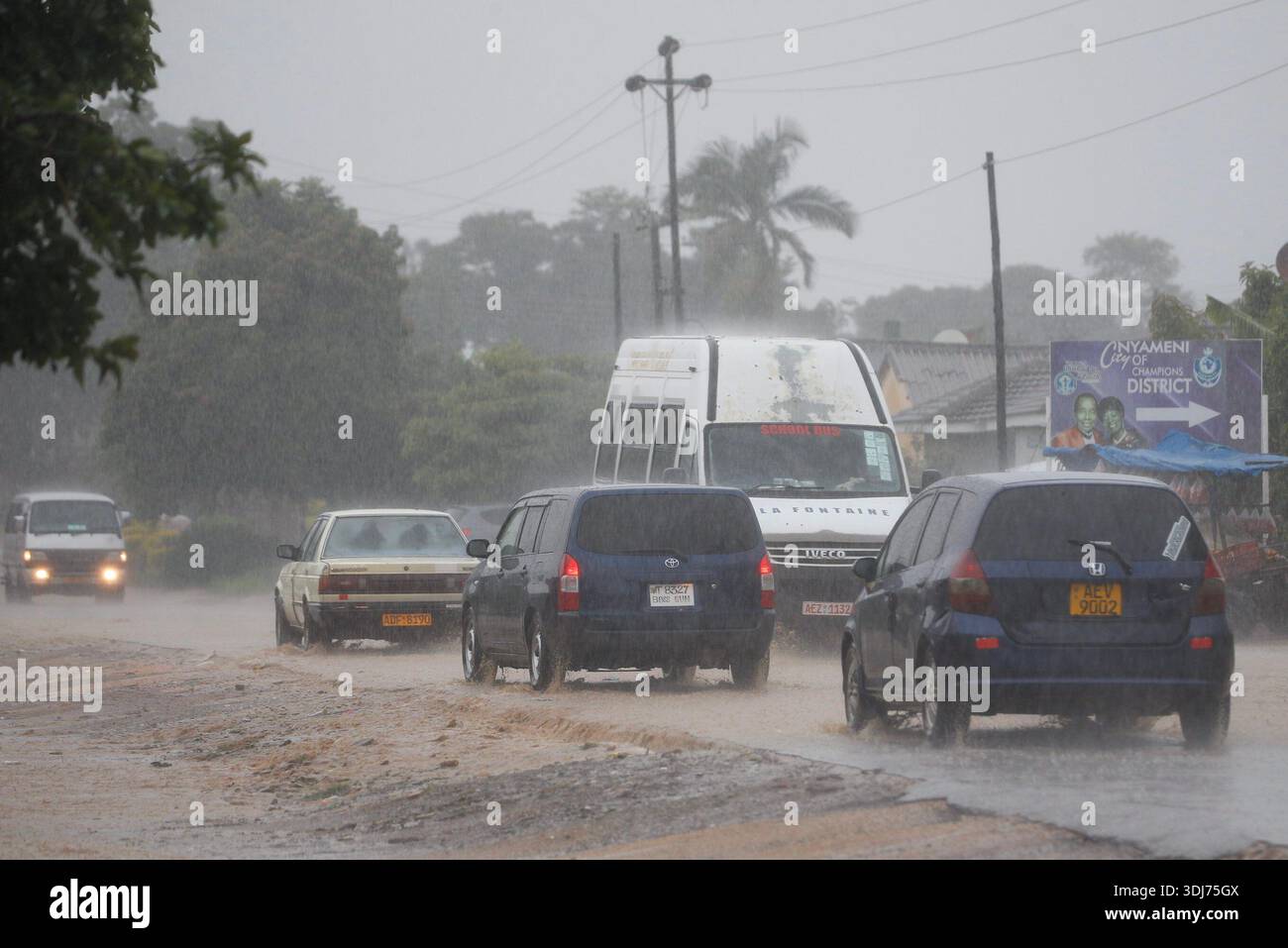 Harare, Zimbabwe. 24th Jan, 2026. Cars drive in heavy rain in Harare ...