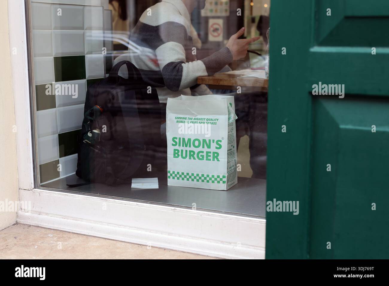 Takeaway bag of the Hungarian fast-food chain Simon's Burger seen ...