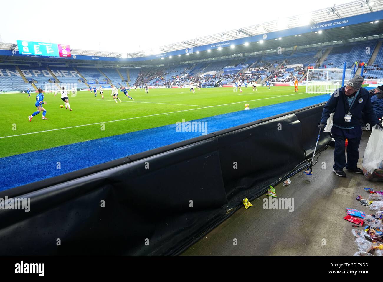 A steward disposes of litter pitch-side during the Barclays Women's ...