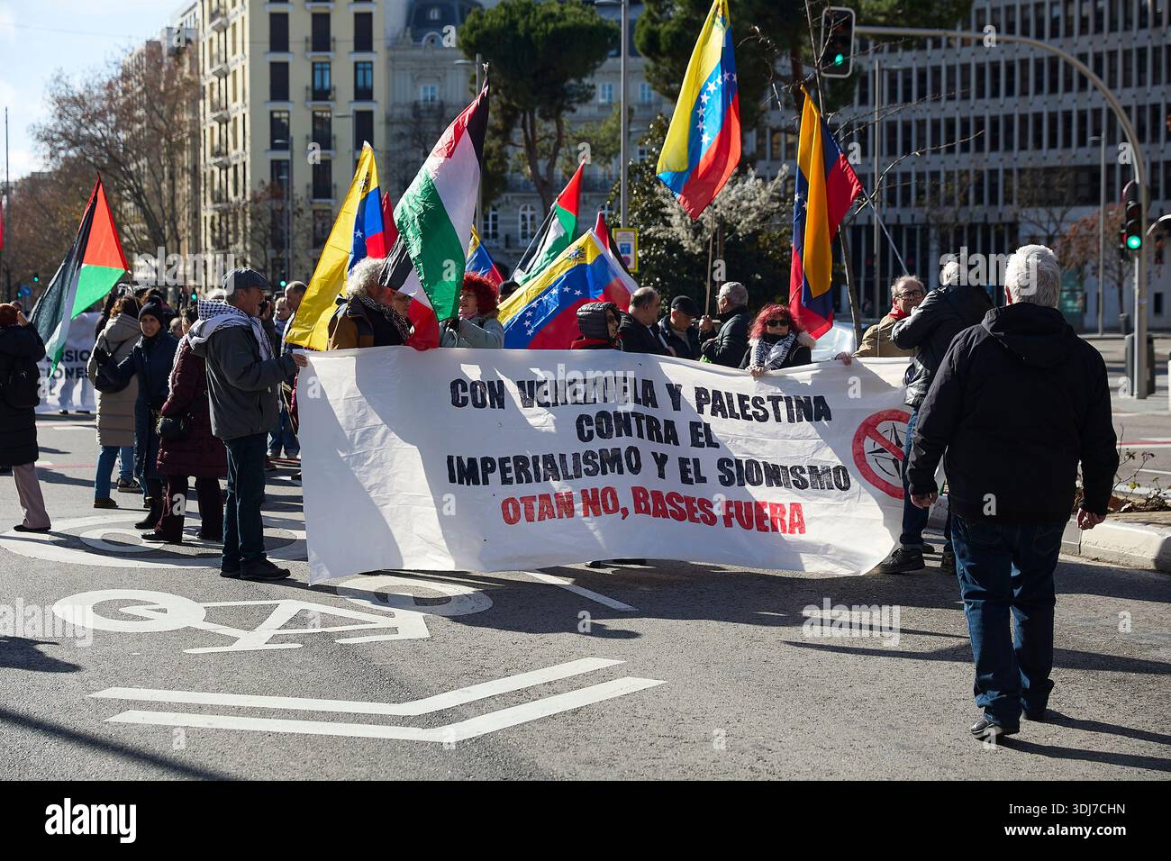 Demonstrators carry a banner with the slogan 'With Venezuela and ...