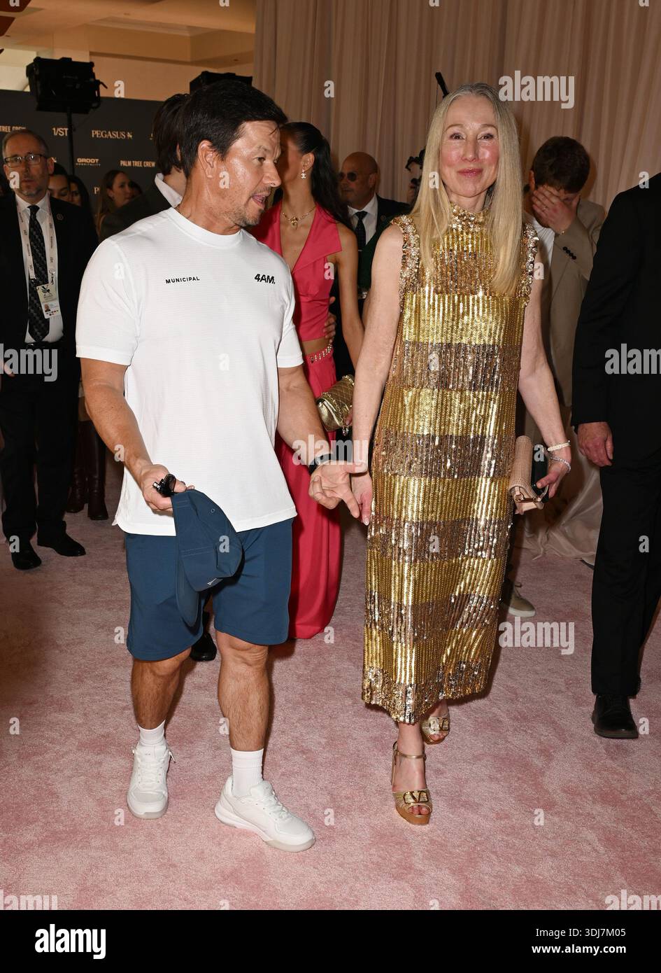Hallandale, Florida, USA. 24th Jan, 2026. Mark Wahlberg and Belinda ...