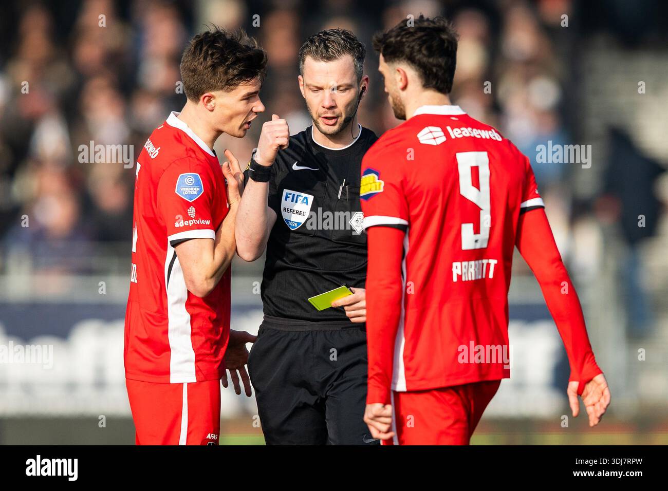VELSEN - Referee Robin Hensgens gives a yellow card to Wouter Goes of ...