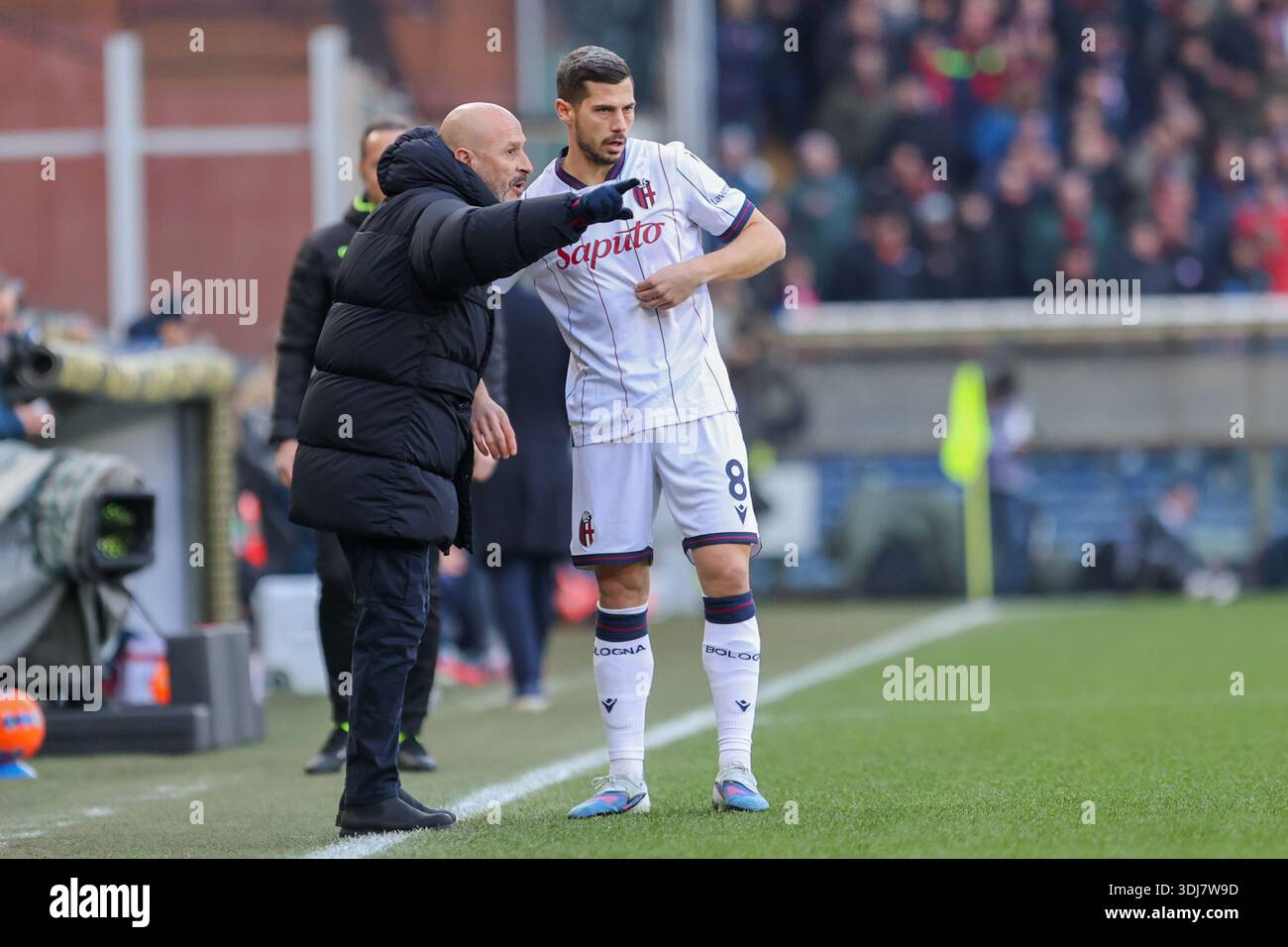 Bologna's head coach Vincenzo Italiano and Bologna's Remo Freuler ...